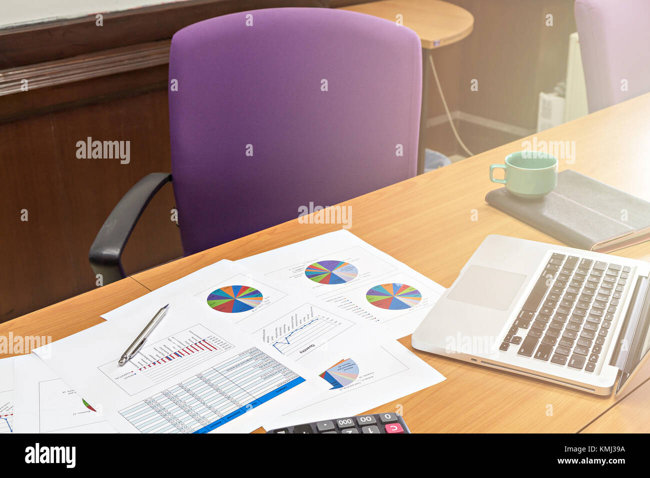 wooden office desk with Laptop, calculator and report paper Stock Photo ...