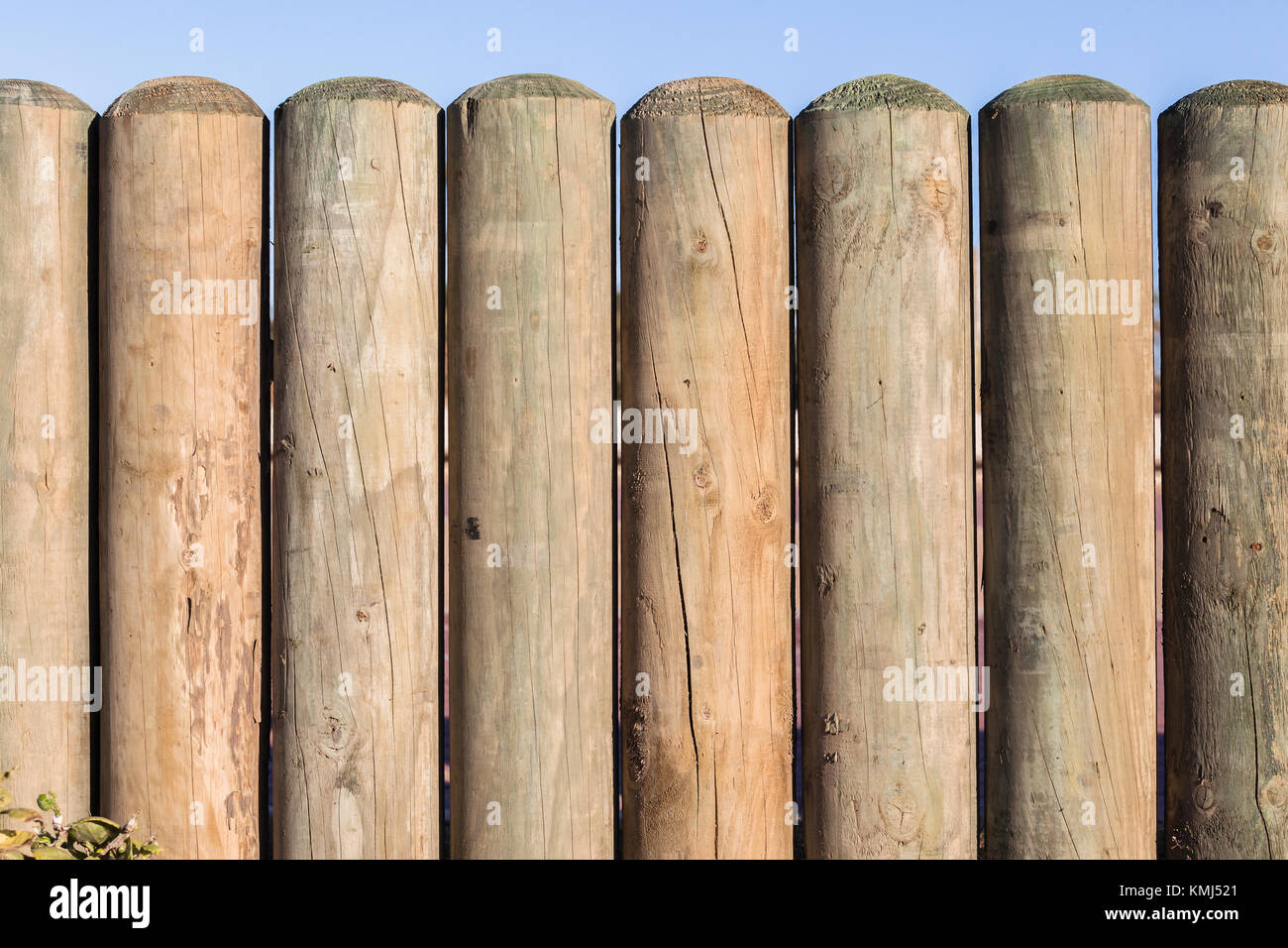 Low Wood pole garden fence closeup decor detail Stock Photo - Alamy