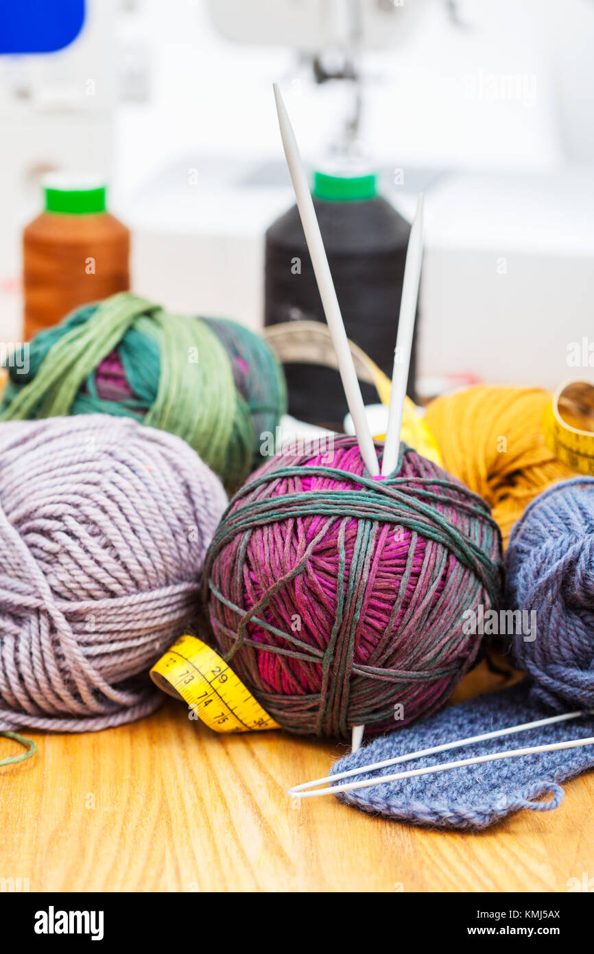 needlework still life - hand knitting and sewing materials on table and ...