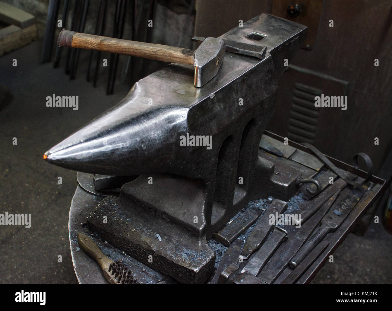 Blacksmith at work, hit with a hammer by a hot metal on the anvil Stock ...
