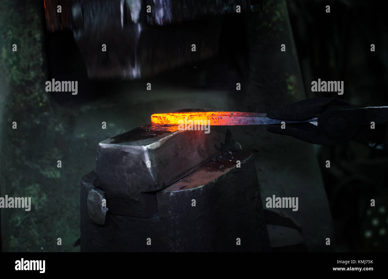 Blacksmith at work, hit with a hammer by a hot metal on the anvil Stock ...