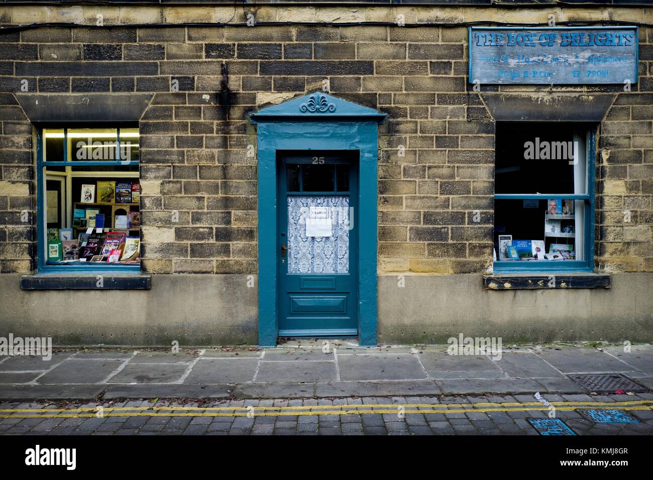 Facade of a book store with door and painted blue windows. Skipton ...