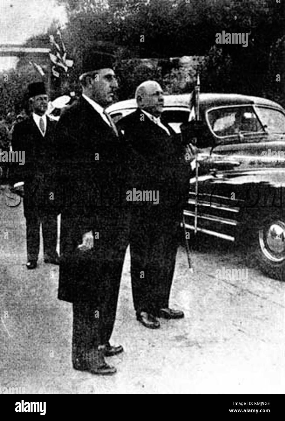 The image presents a notable photograph featuring Khouri and Quwatli ...