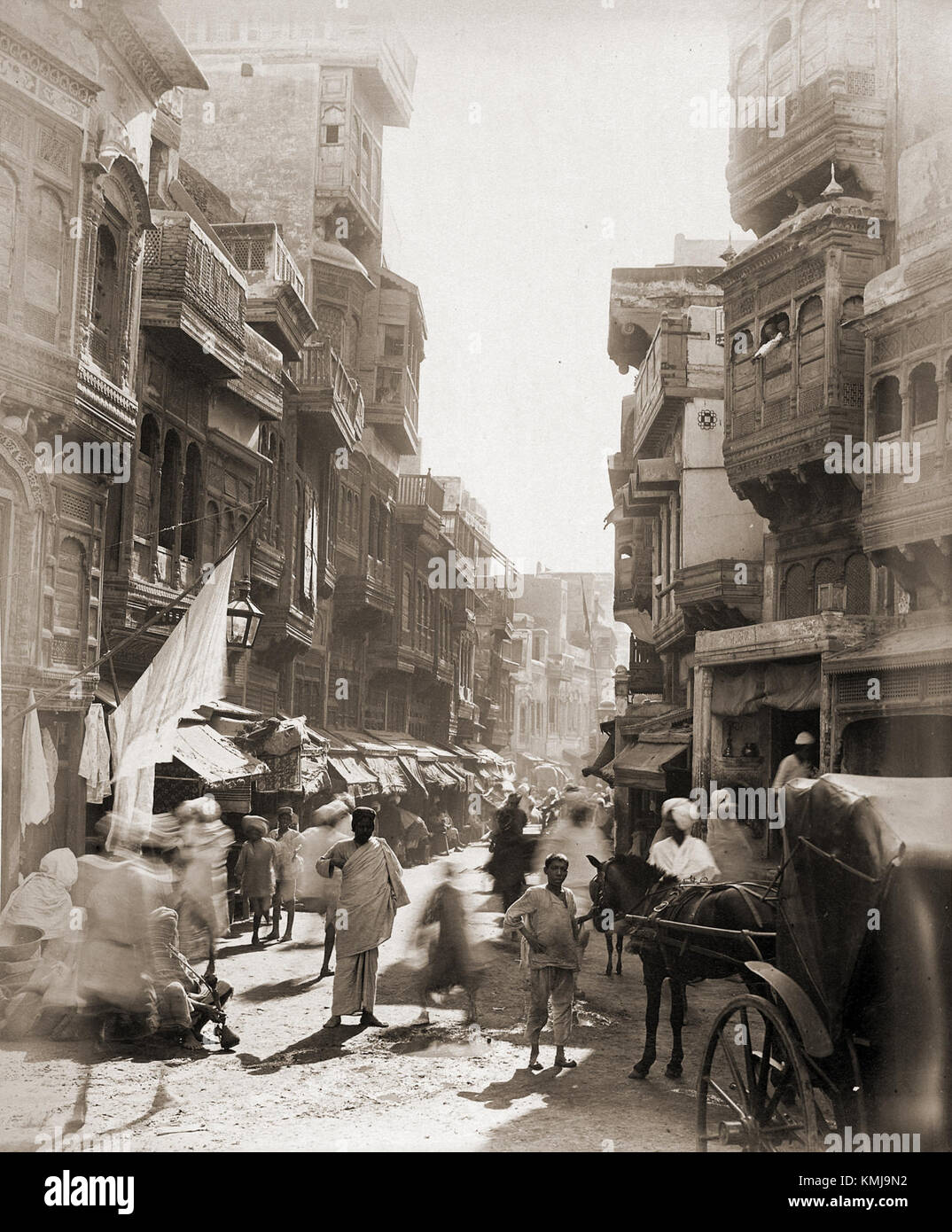 This vintage photograph shows an old view of a street in Lahore ...