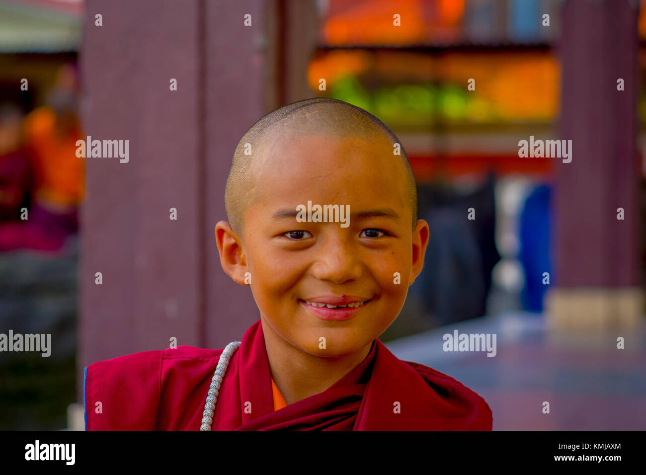 POKHARA, NEPAL - OCTOBER 06 2017: Portrait of buddhist monk boy smiling ...