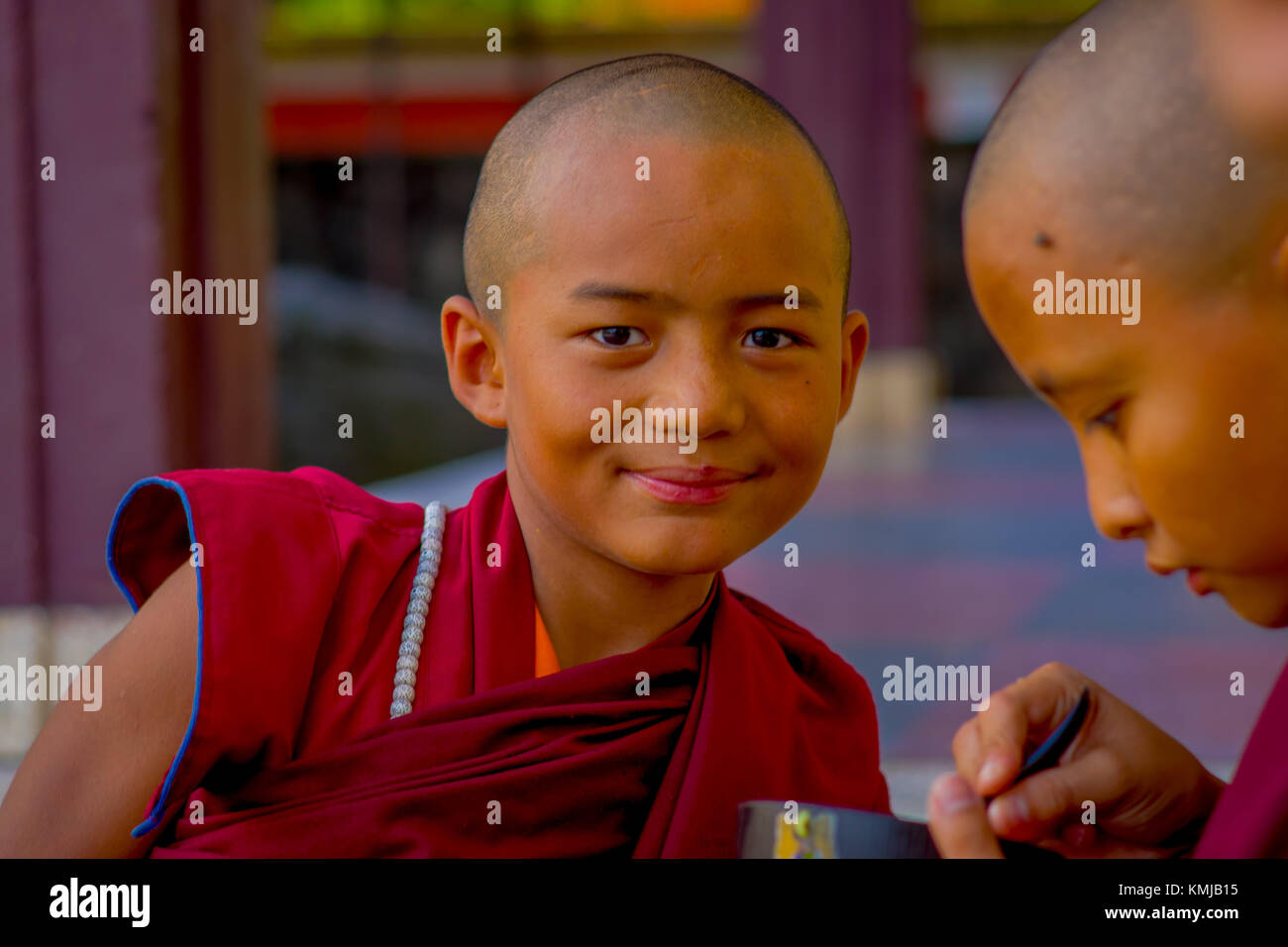 POKHARA, NEPAL - OCTOBER 06 2017: Portrait of buddhist monk boy smiling ...