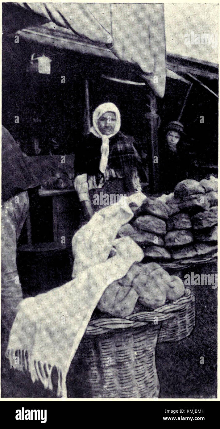 This image depicts a bread seller at the Funchal Market in Madeira ...