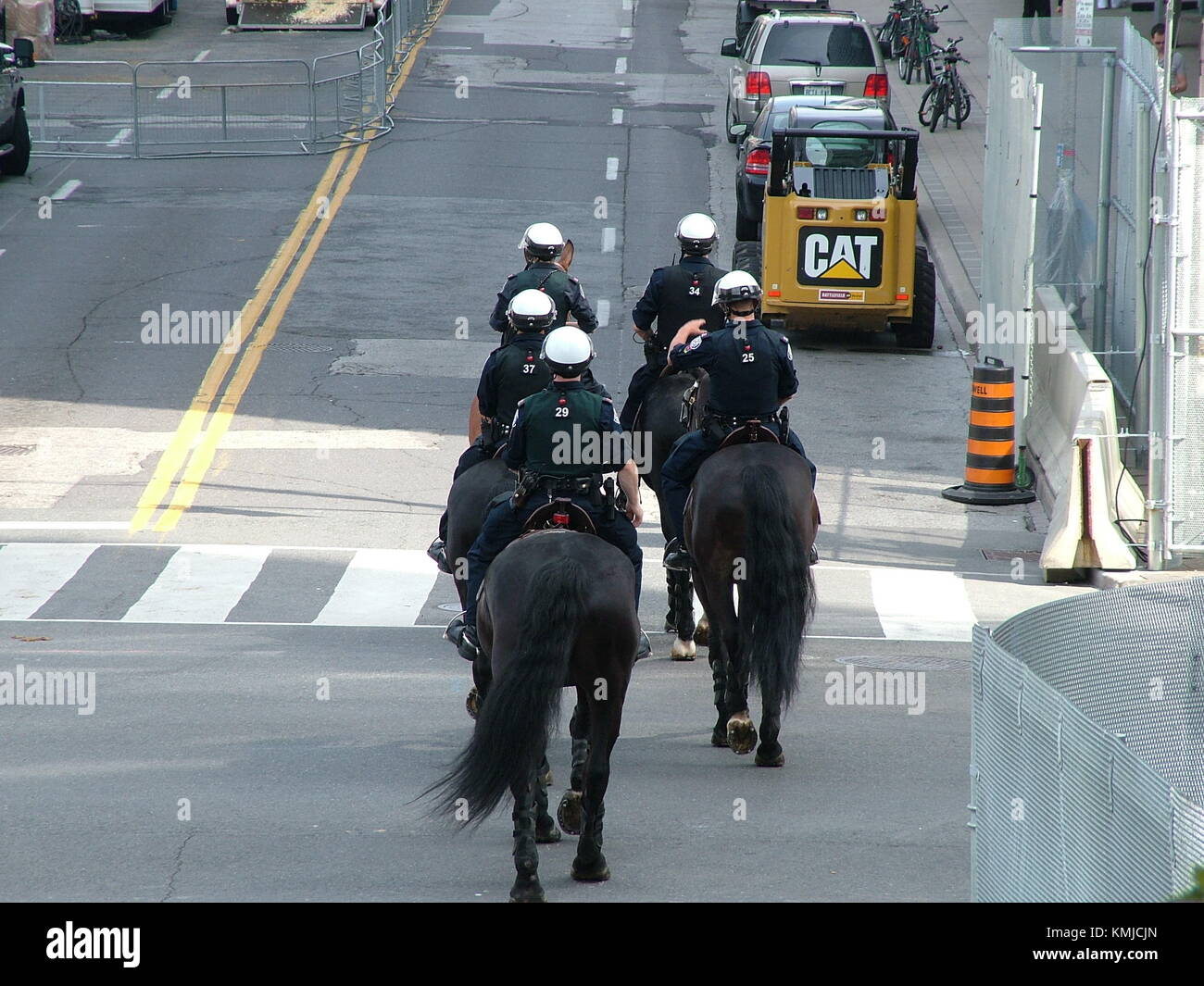 TORONTO - JUNE 23, 2010 - Police officers marching on the streets on ...