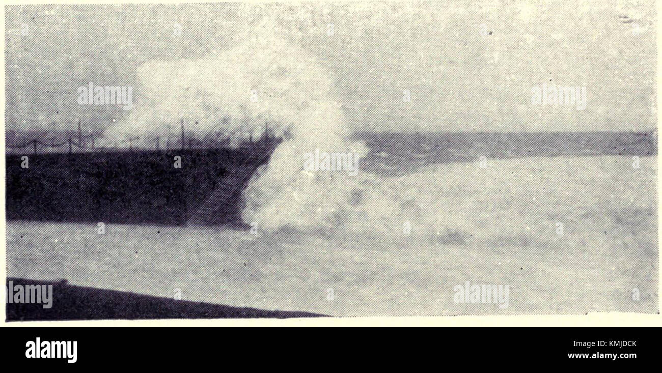 This image from 1909 shows surfers riding waves near the jetty at ...