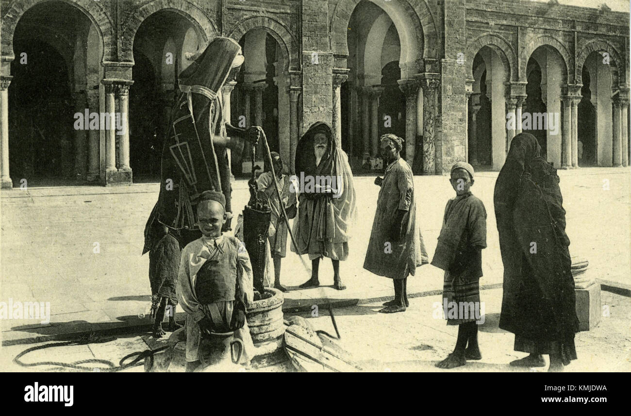 The postcard from 1900 features the historic Mosque of Kairouan in ...