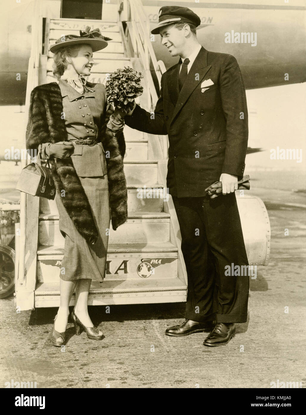 Unidentified actress receiving flowers as she arrives Stock Photo - Alamy