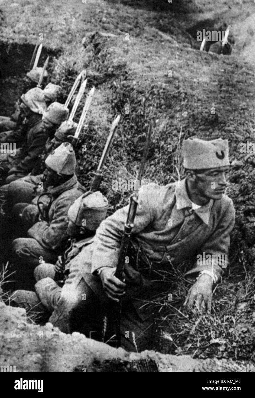 This photograph shows Turkish infantry soldiers positioned in a trench ...