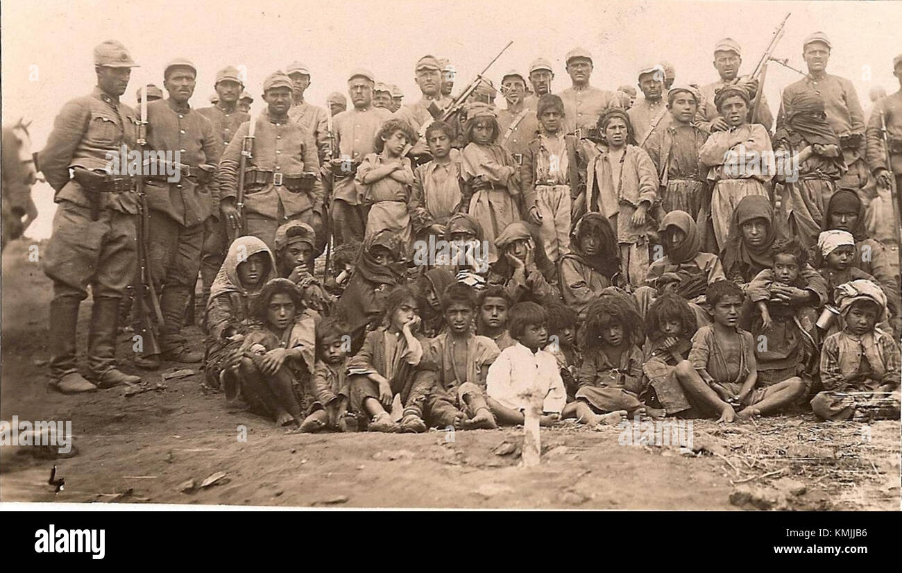 This photograph captures Turkish soldiers interacting with local people ...