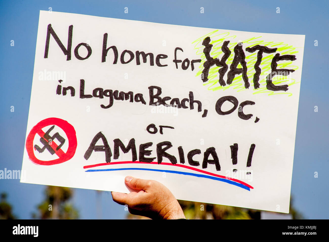 A counter demonstrator's sign expresses toleration at an anti ...