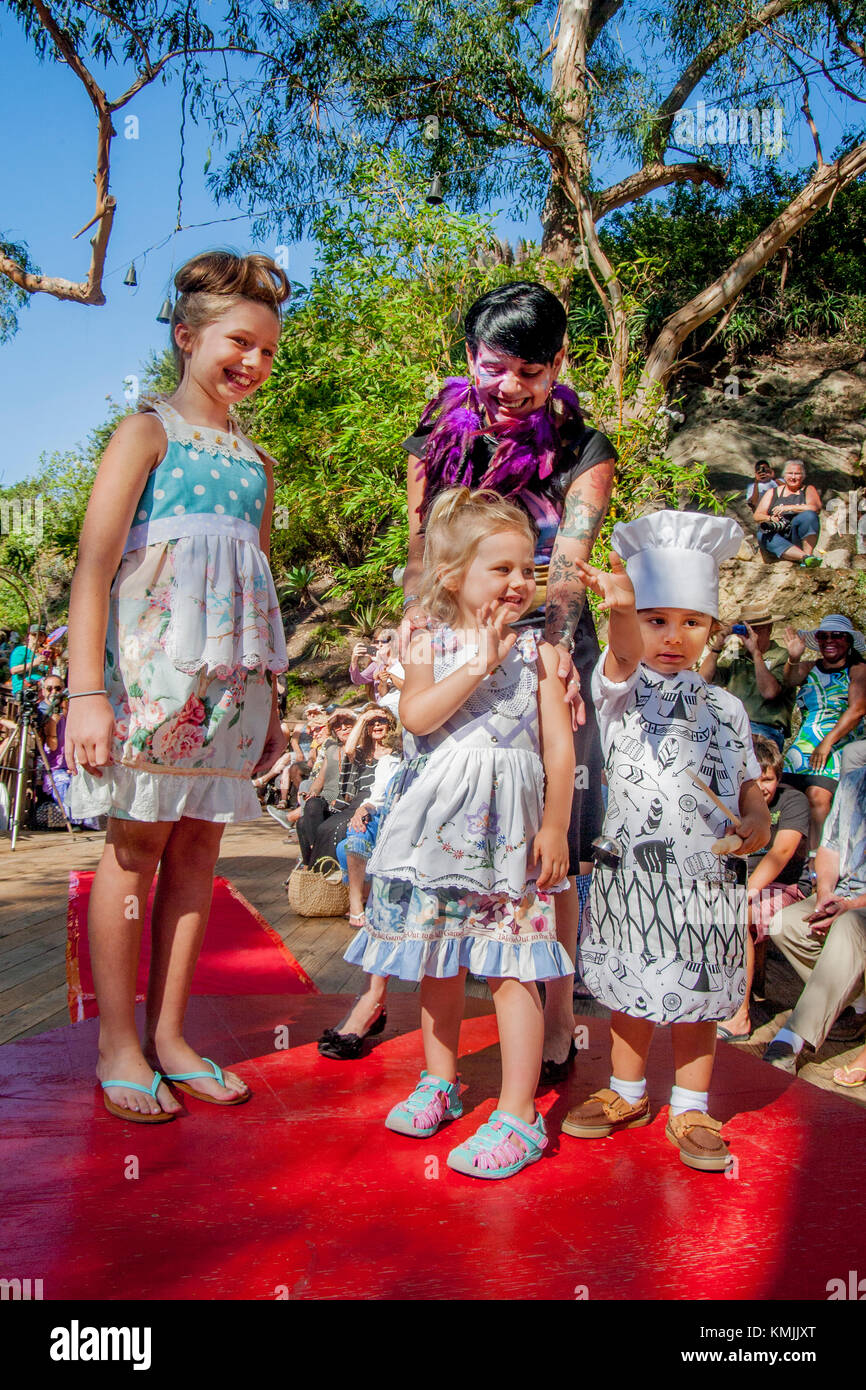 Amiable children model designer clothing at an outdoor fashion show in ...