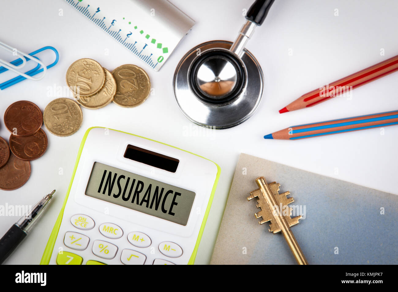 insurance concept. White office desk with calculator Stock Photo - Alamy
