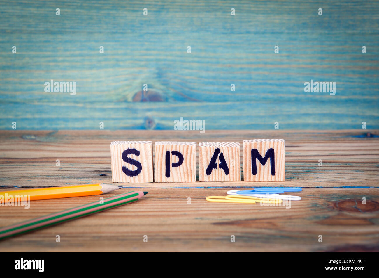 Spam - name from wooden letters. Office desk, informative and ...