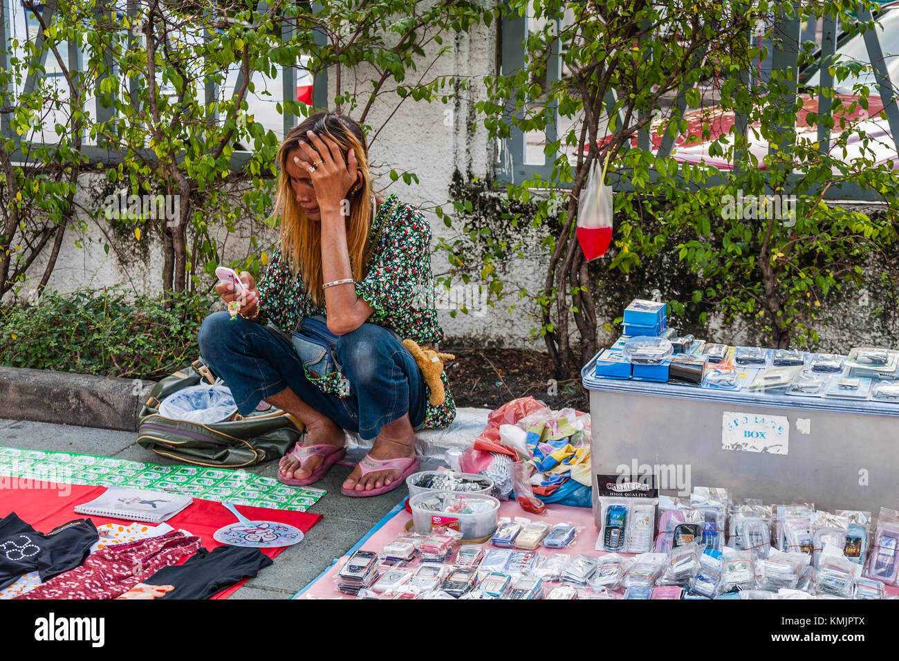 A Thai woman selling goods in the street of Bangkok Stock Photo - Alamy