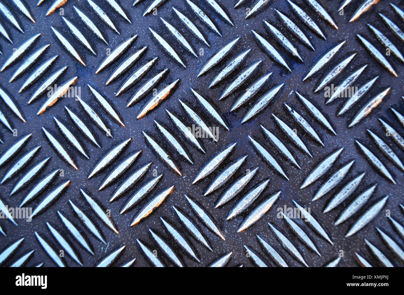 Close up of metal sheet with raised detail Stock Photo - Alamy