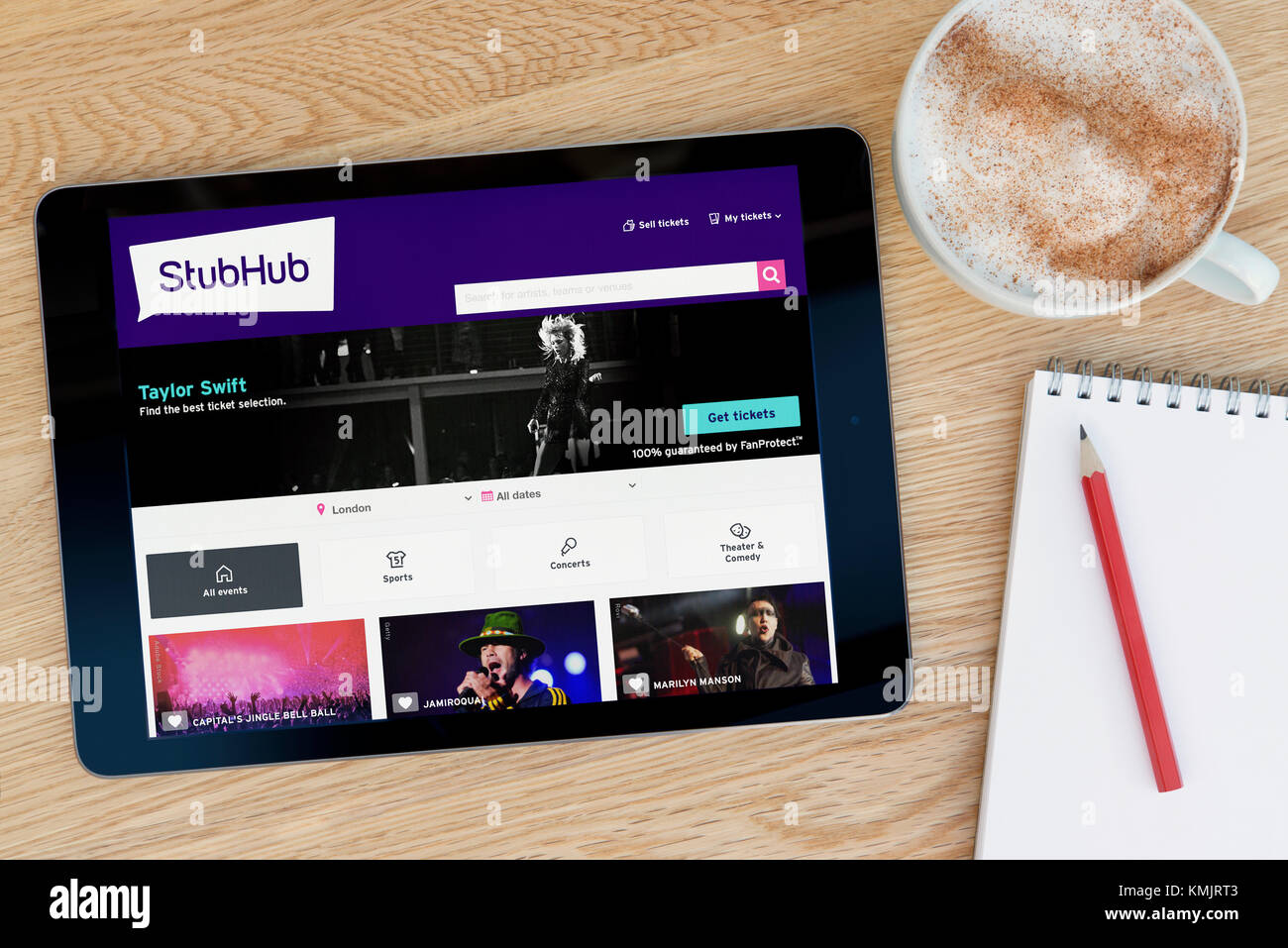 The Stubhub website features on an iPad tablet device which rests on a ...