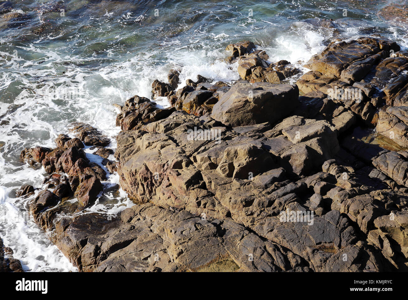 Sea waves splashing on the stone reef off the coast Stock Photo - Alamy