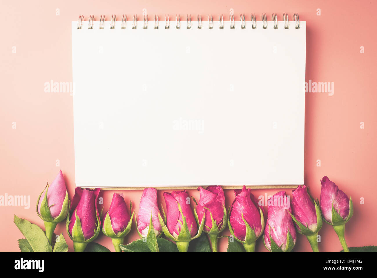 Pink roses top view flat lay border with blank notepad,for valentine ...