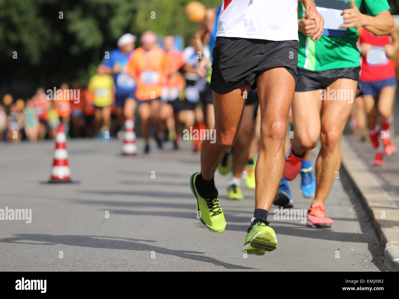 legs of runner while he runs at marathon race Stock Photo - Alamy