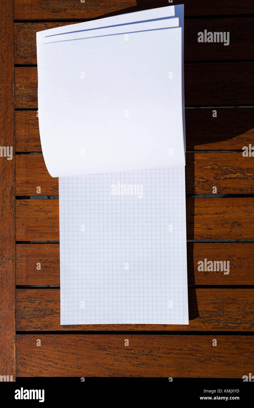 Empty blank rectangular white simple notepad with wind-blown sheet of ...