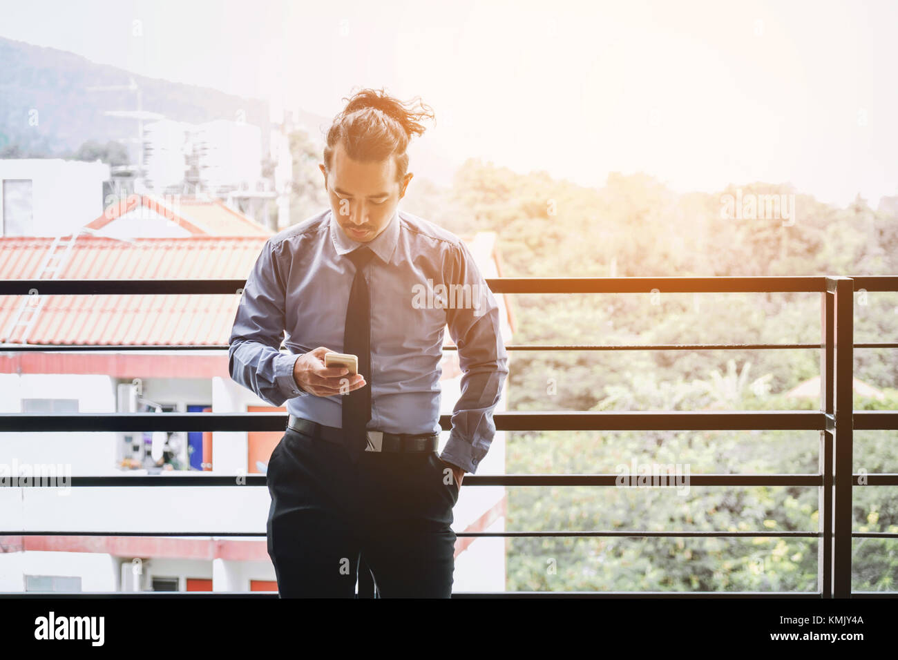 Businessman Using Mobile Phone in outdoor office Stock Photo - Alamy