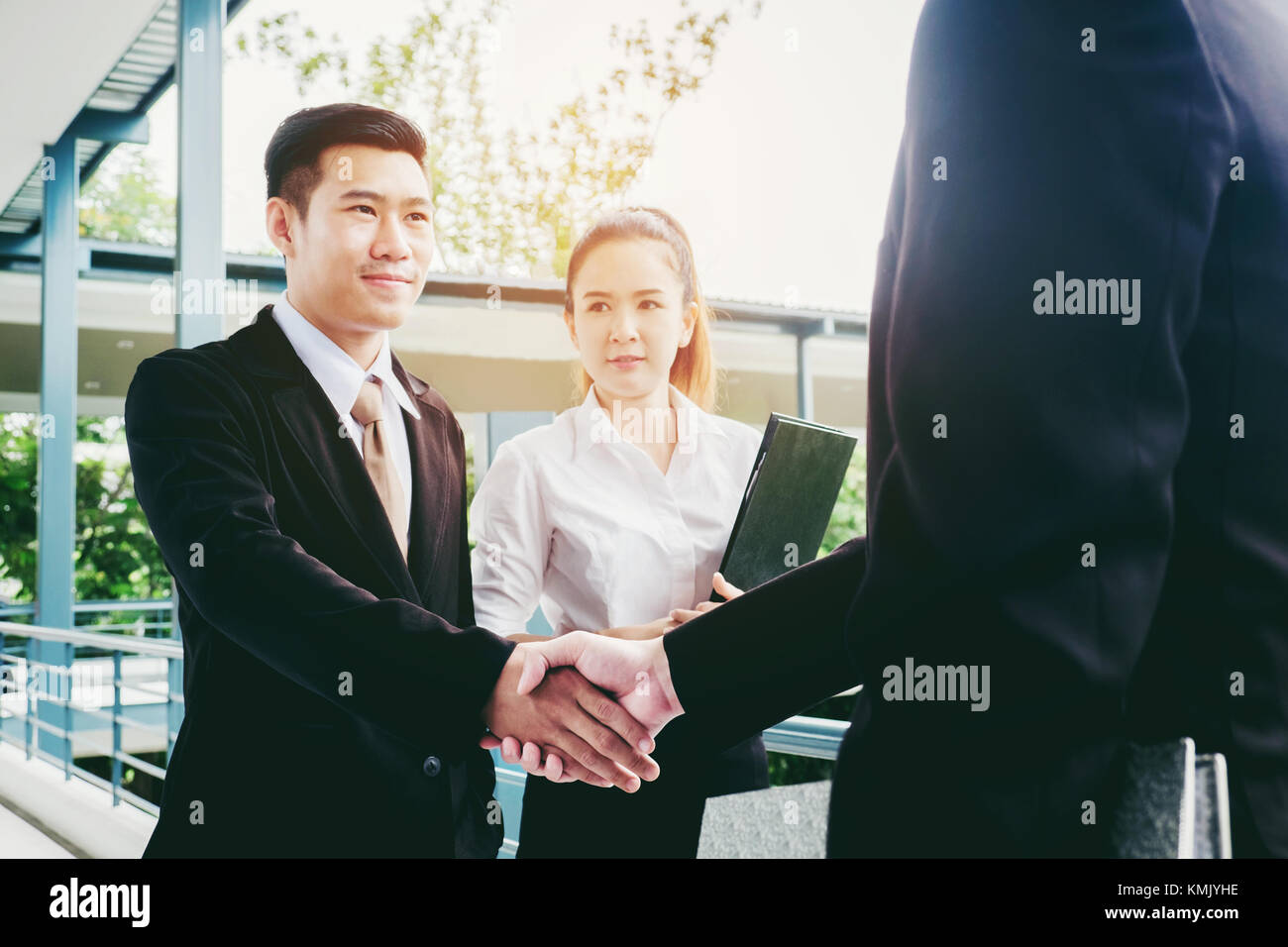 Asian Business Handshake at city outside office Success concept Stock ...