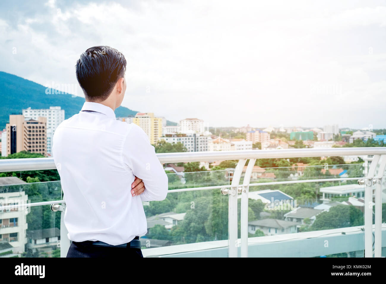 Back view of success Business man looking view the city Stock Photo - Alamy