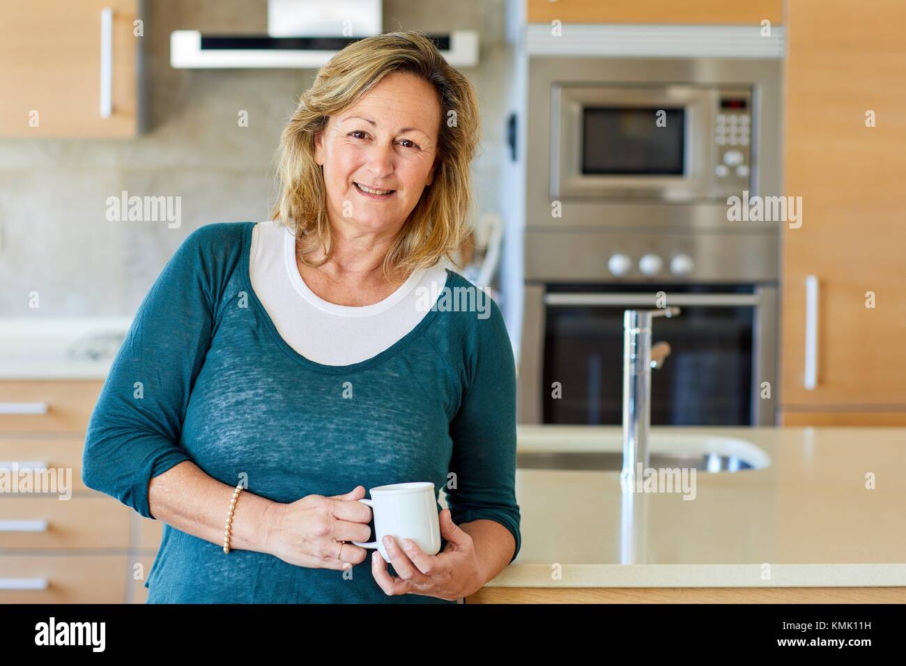Kitchen interior woman hi-res stock photography and images - Alamy