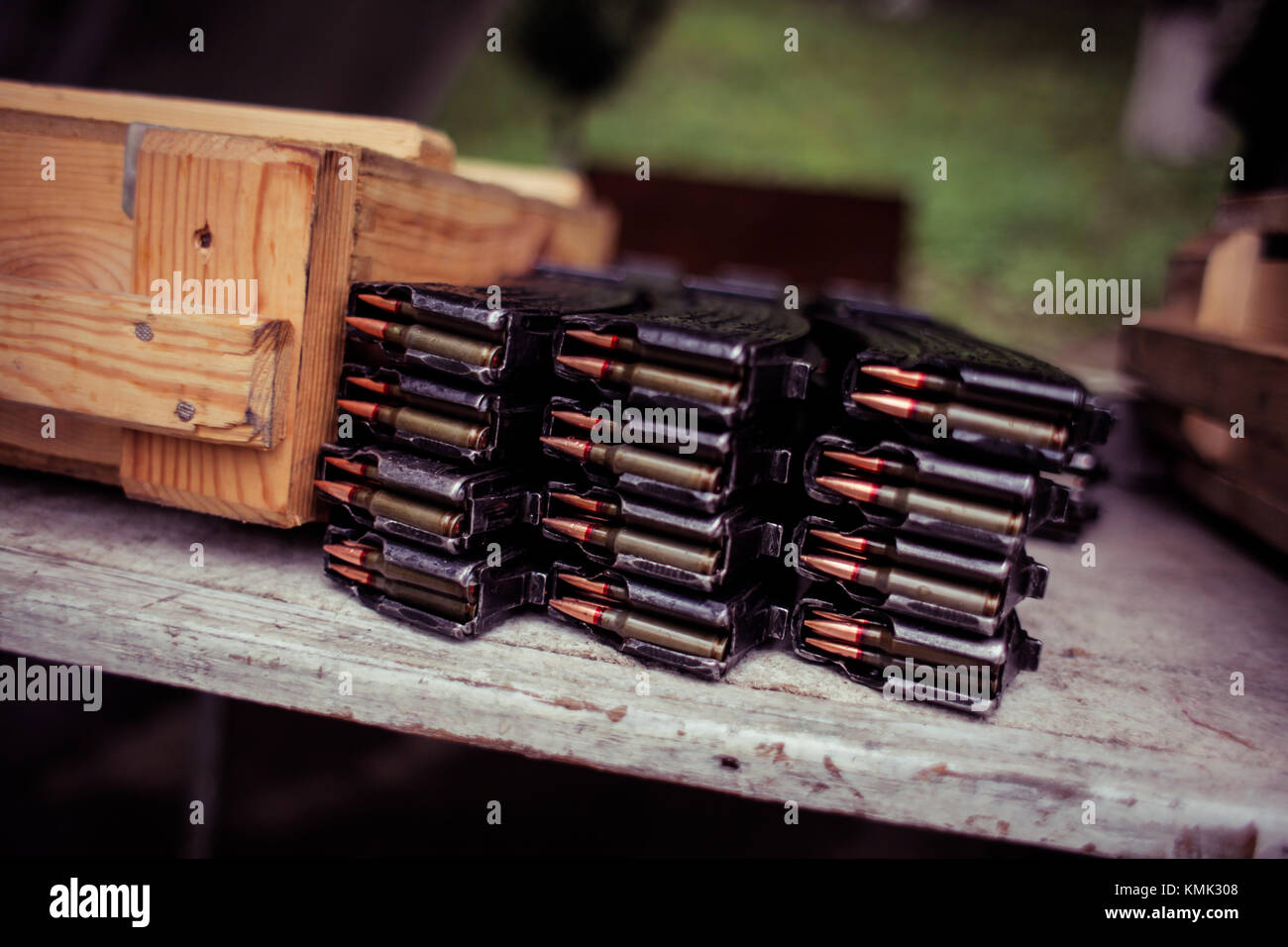 Automatic rifle cartridge with bullets on a military shooting range ...