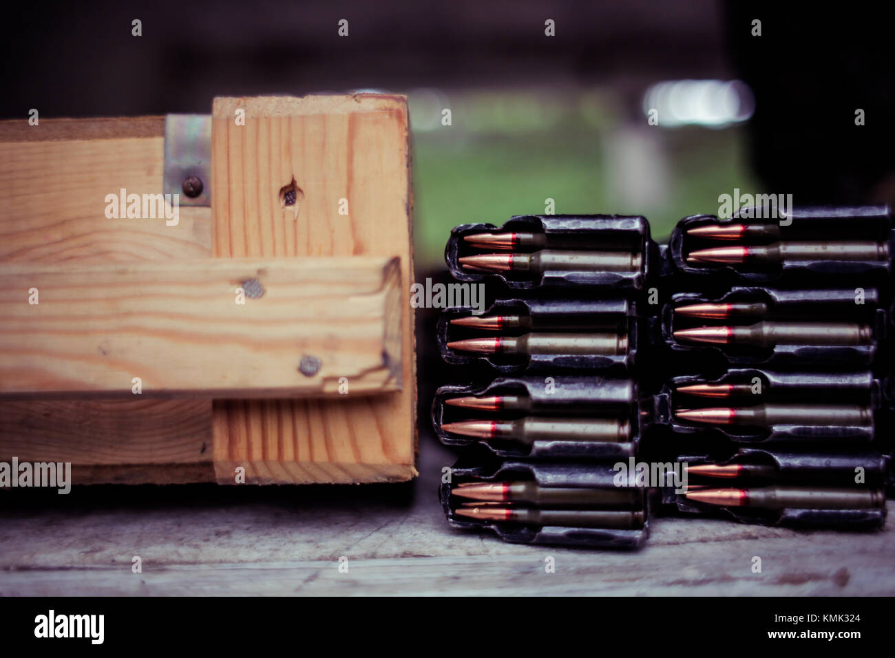 Automatic rifle cartridge with bullets on a military shooting range ...