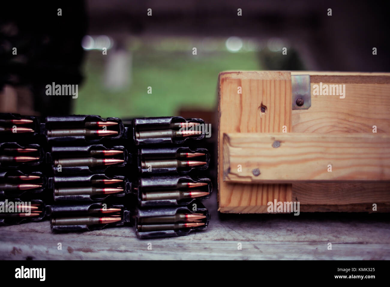 Automatic rifle cartridge with bullets on a military shooting range ...