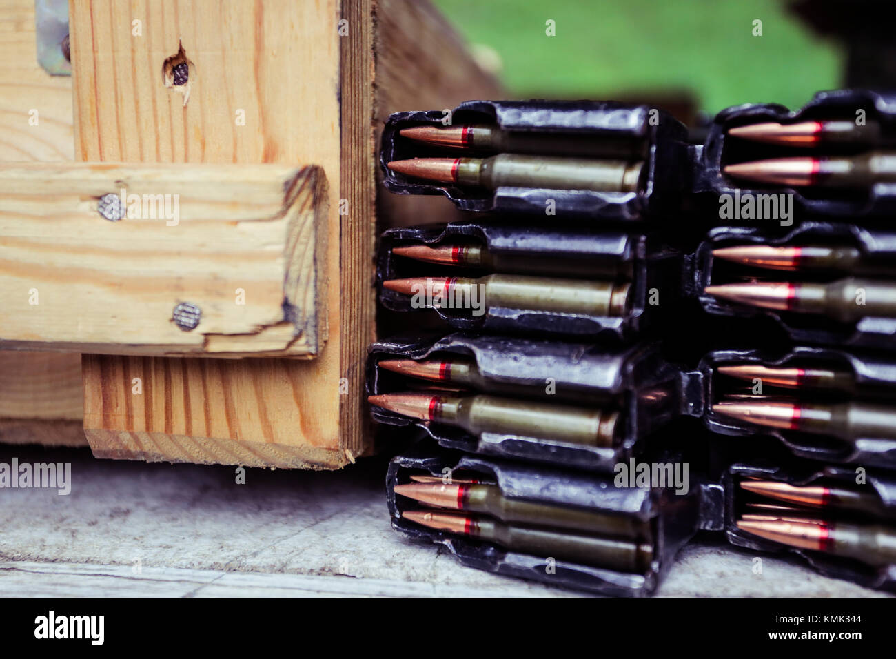 Automatic rifle cartridge with bullets on a military shooting range ...