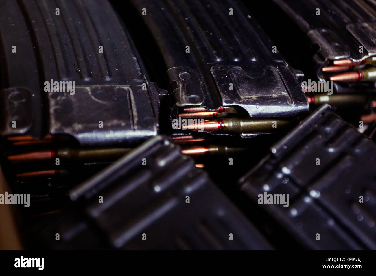 Automatic rifle cartridge with bullets on a military shooting range ...