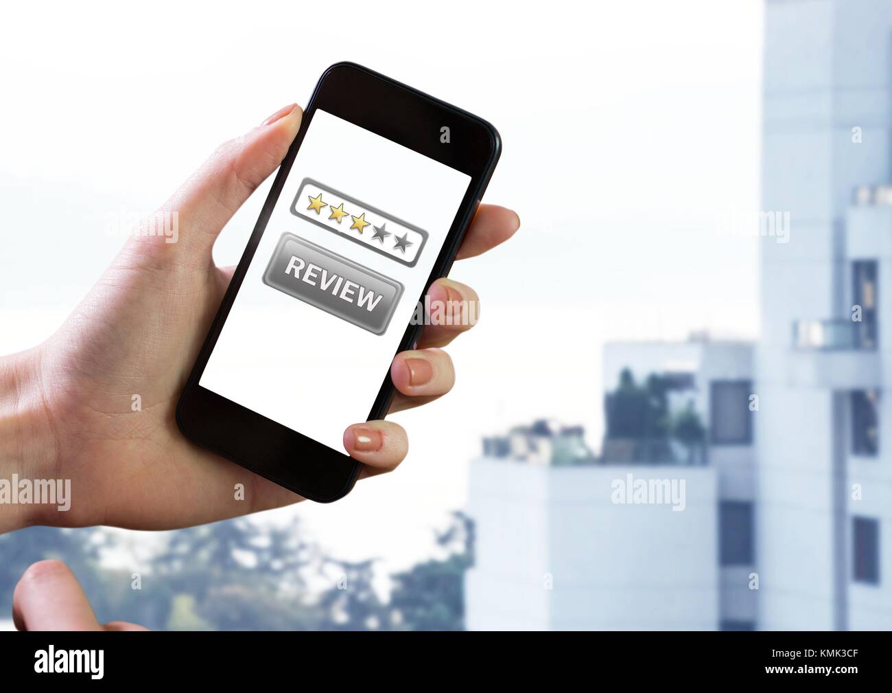 Digital composite of Hand holding phone and Review button with stars ...