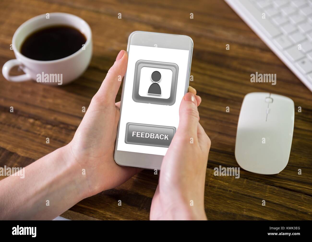 Digital composite of Hand holding phone with user feedback button Stock ...