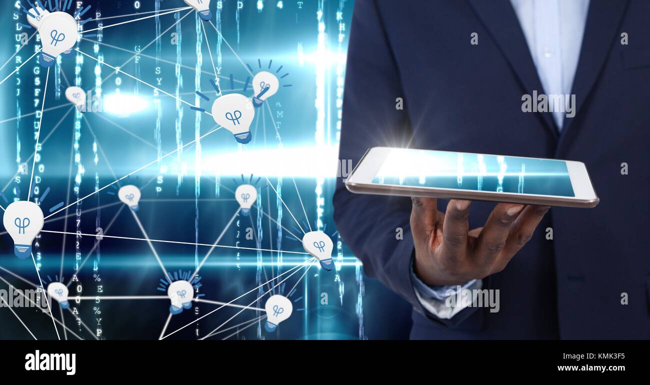 Digital composite of Hand holding tablet with light bulb icons in ...