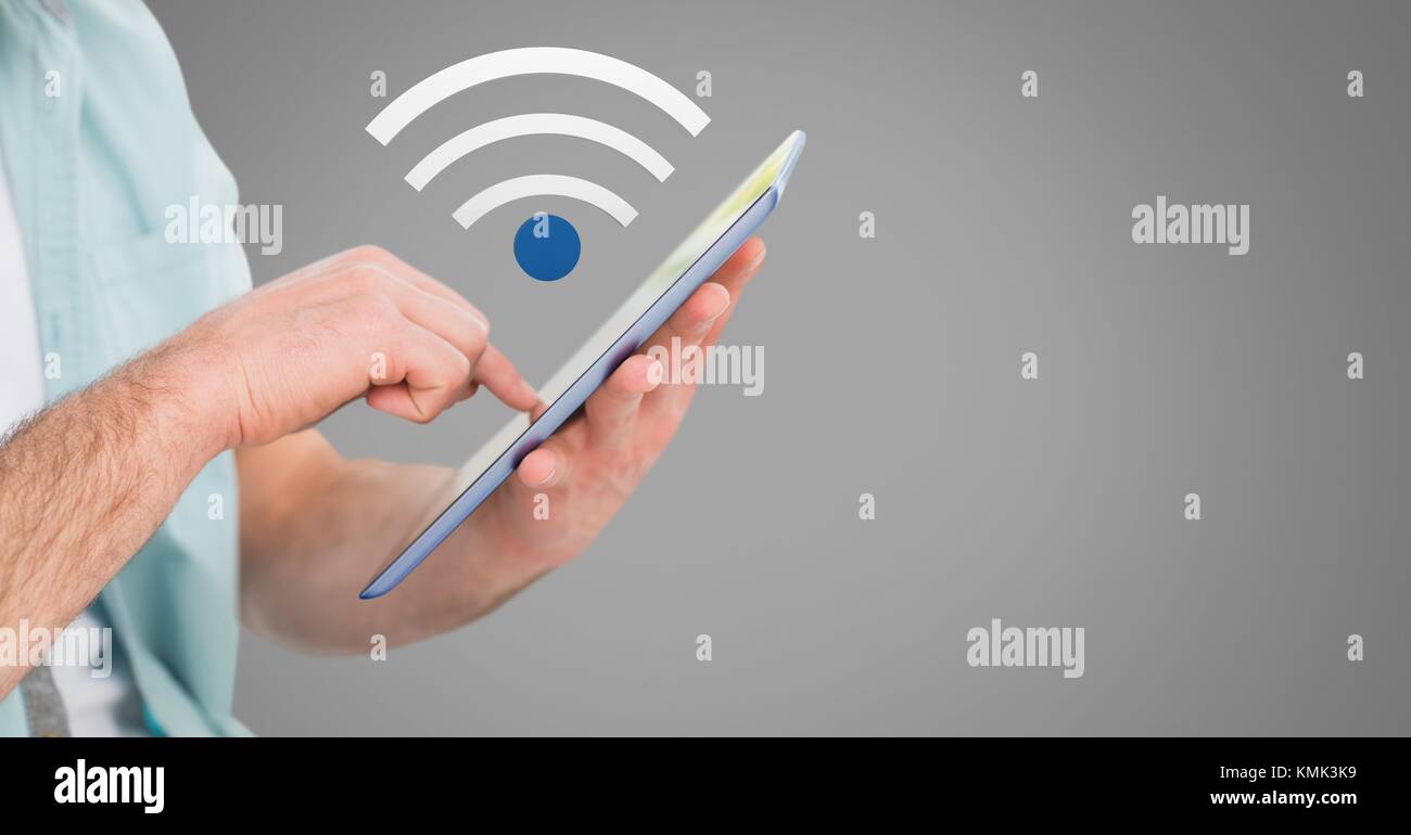 Digital composite of Hand holding tablet with 3D wi-fi icon Stock Photo ...
