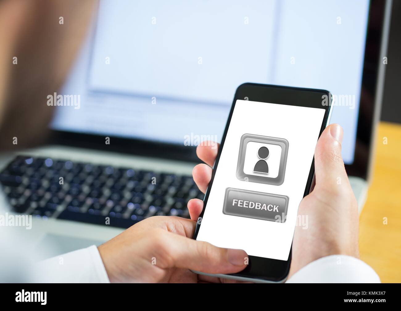 Digital composite of Hand holding phone with feedback buttons Stock ...