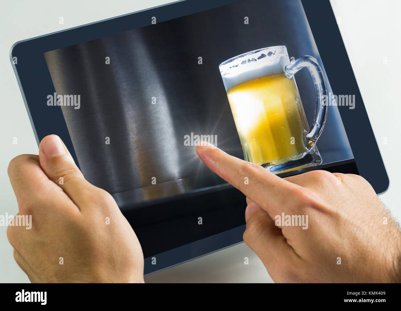 Digital composite of Hand touching tablet with beer in bar Stock Photo ...