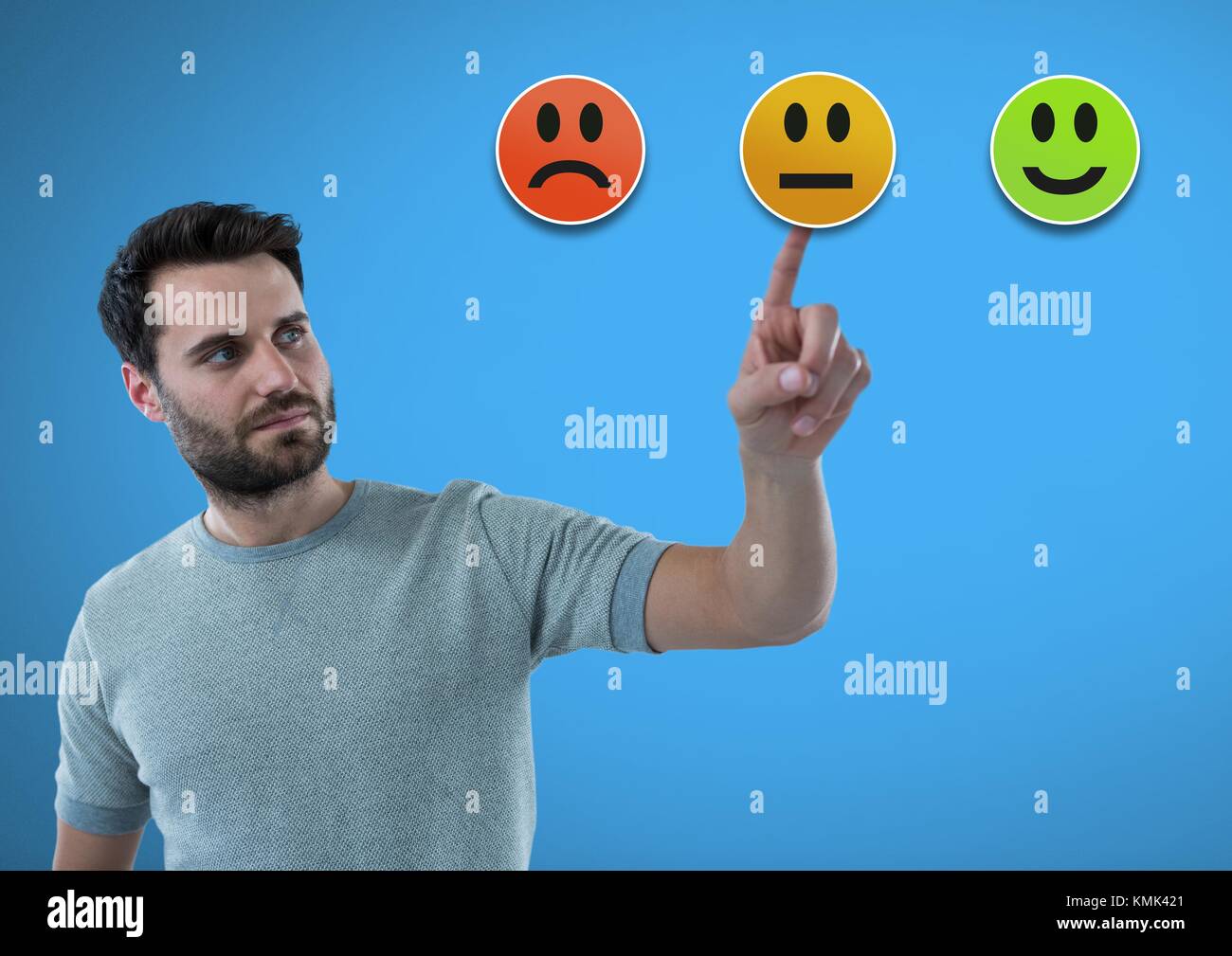 Digital composite of Man touching feedback smiley satisfaction icons ...