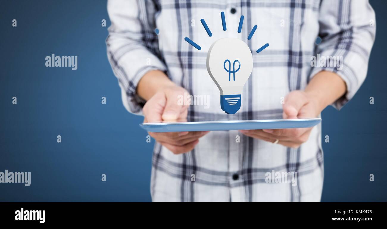 Digital composite of Hand holding tablet with 3D light bulb idea icon ...