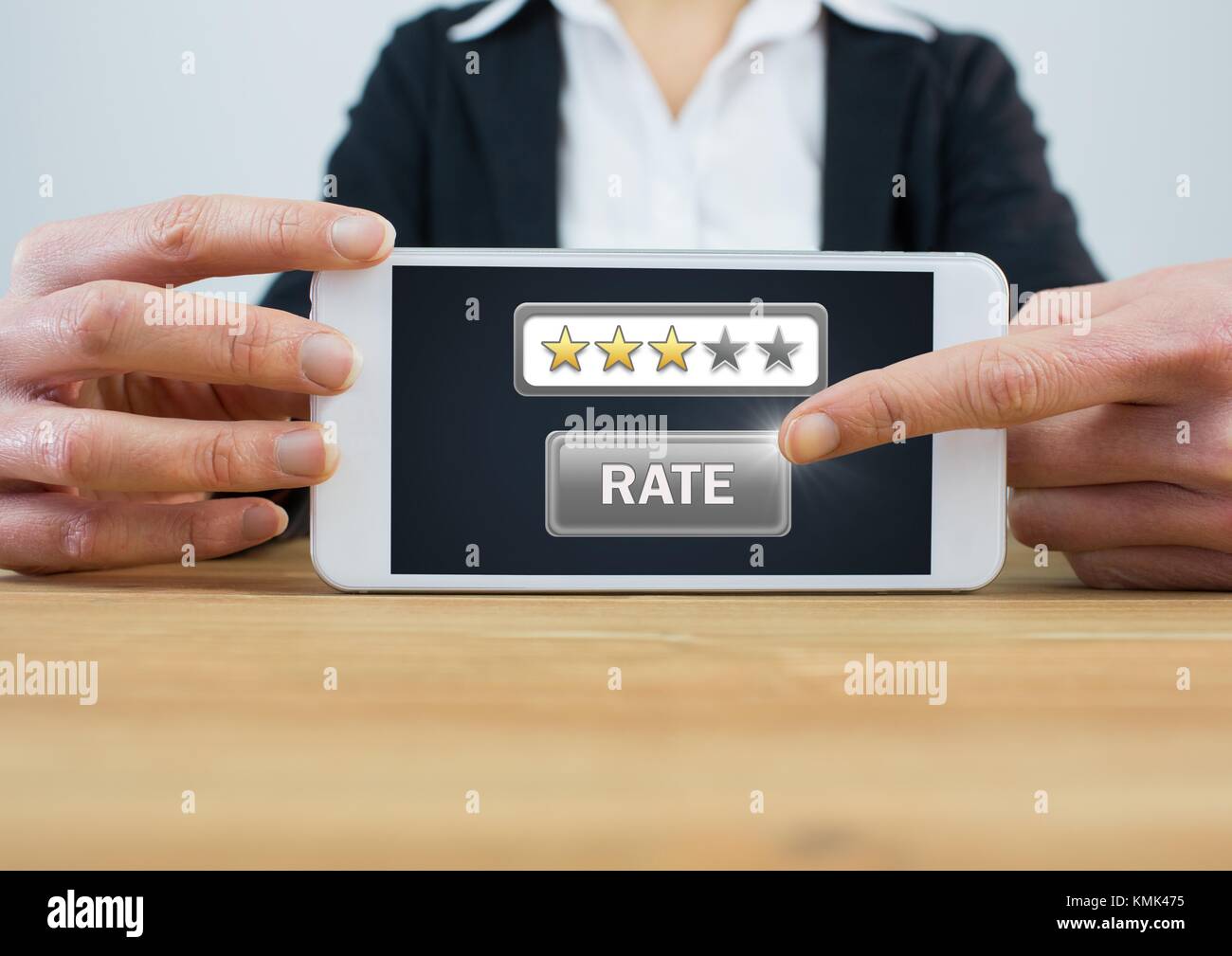 Digital composite of Woman holding tablet with rate button and star ...