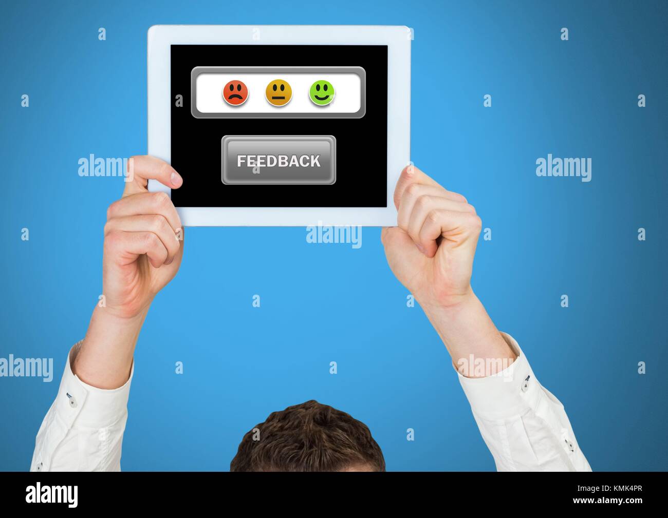 Digital composite of Man holding tablet with feedback smiley ...