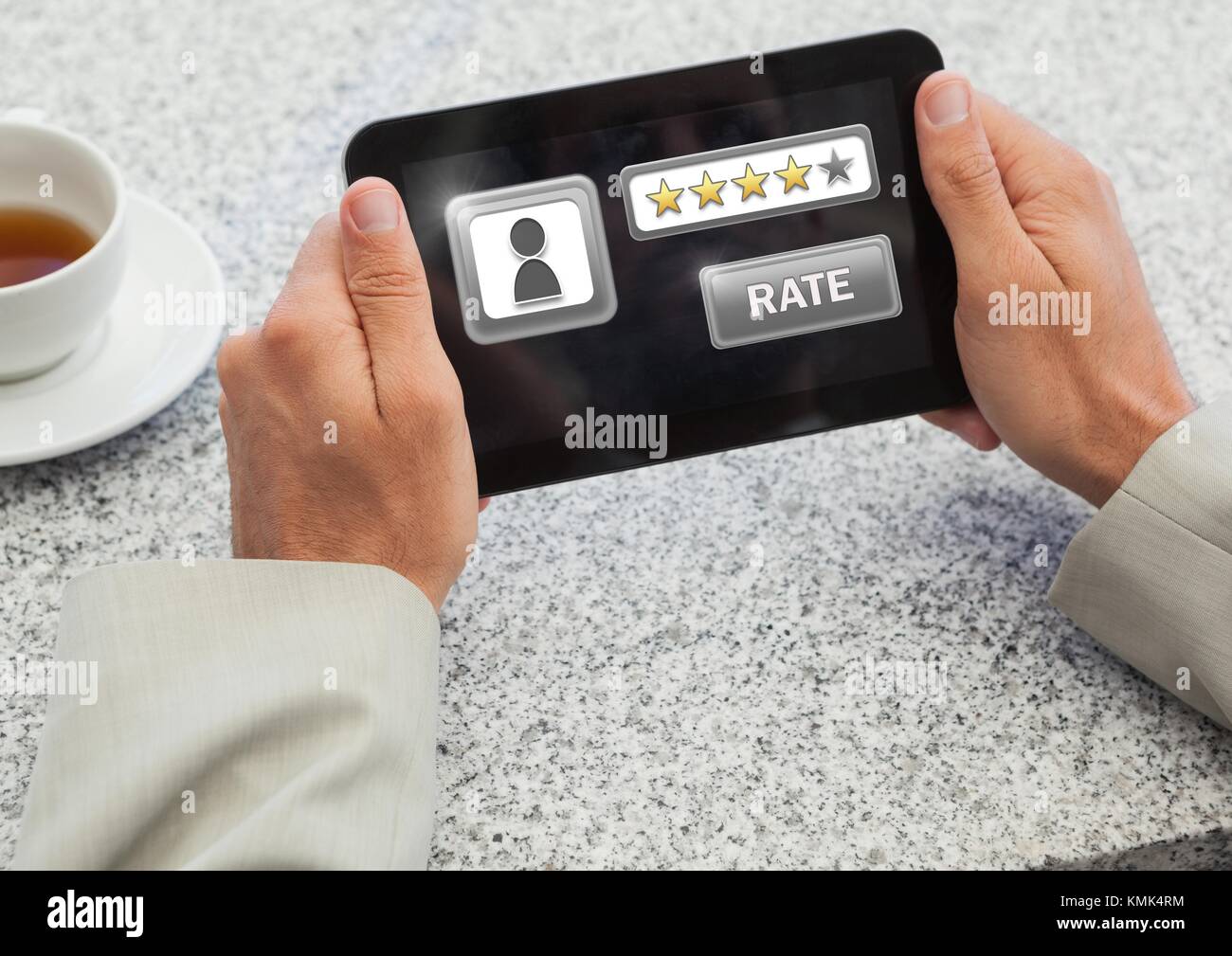 Digital composite of Hands holding tablet with rate button and star ...