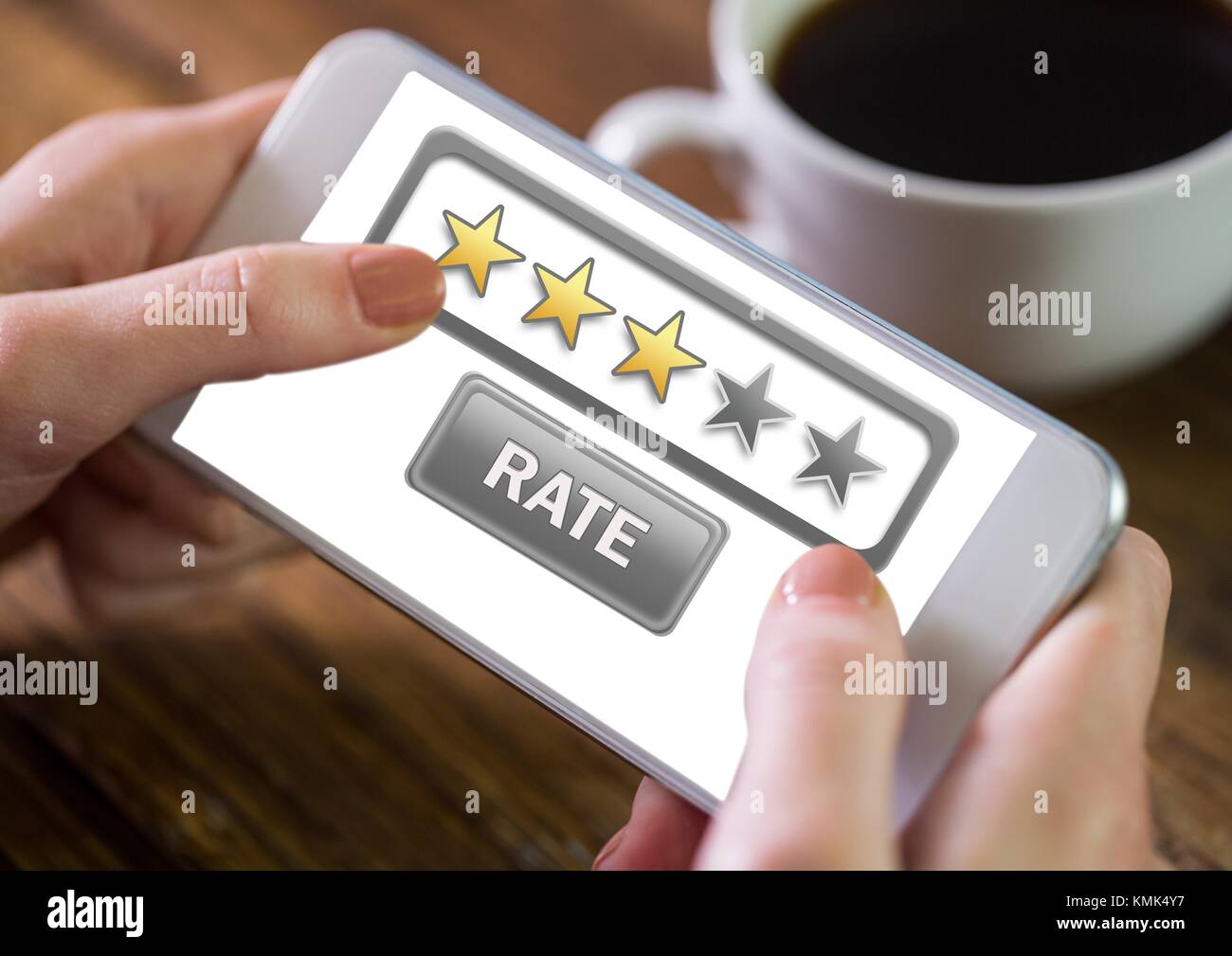 Digital composite of Hand holding phone with rate button and star ...