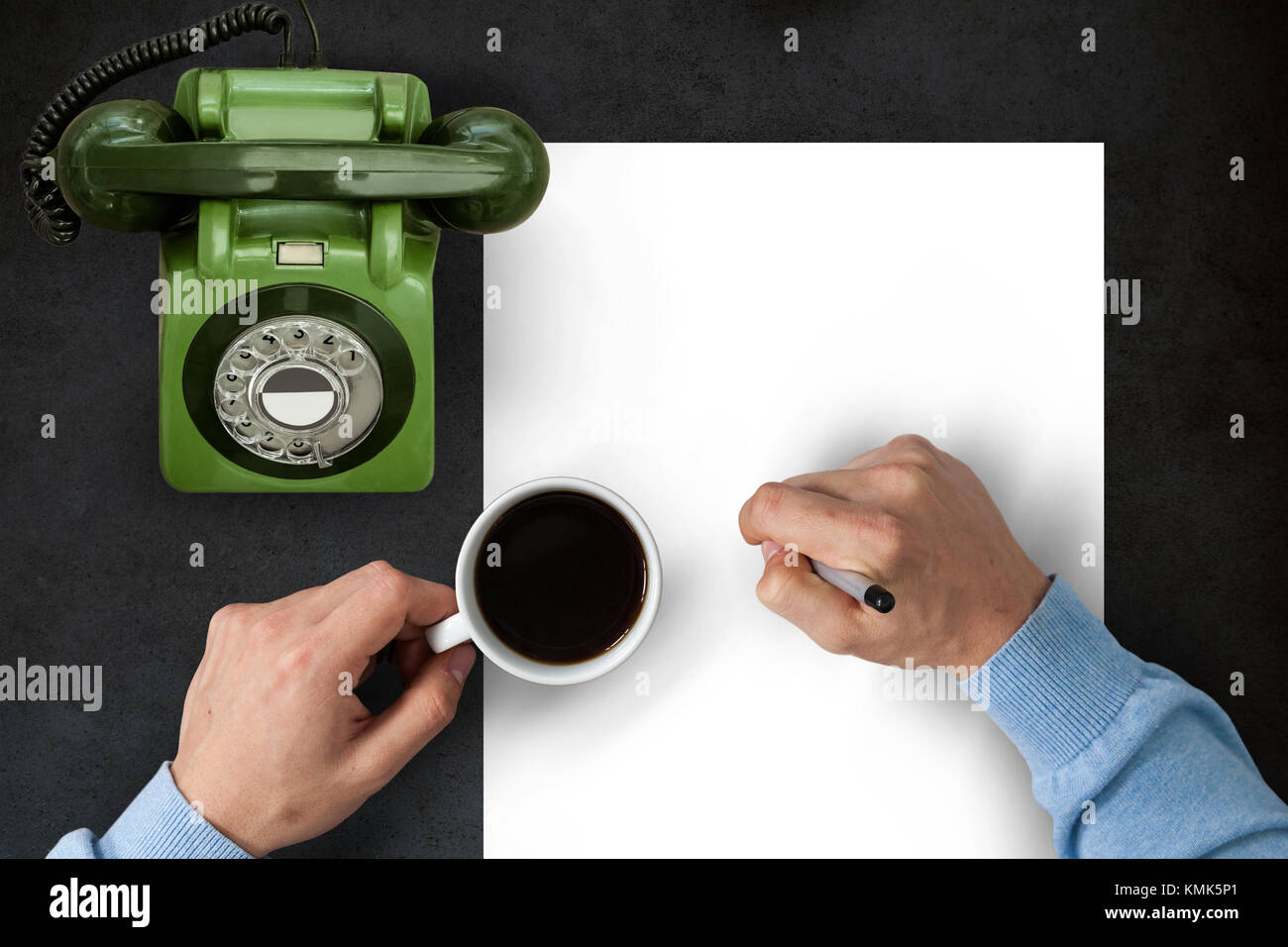 Man writing on paper while drinking coffee Stock Photo - Alamy
